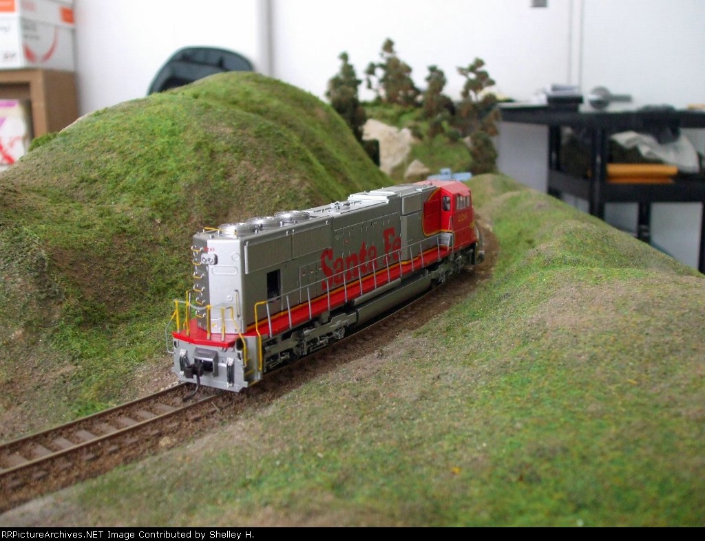 My New Warbonnet SD75 going through the sceniced area of the layout
